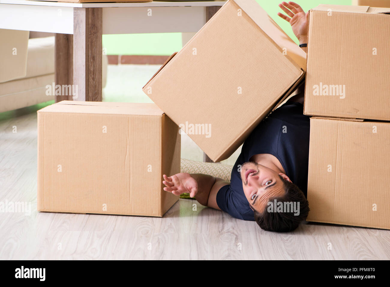 Man moving house with boxes Stock Photo - Alamy