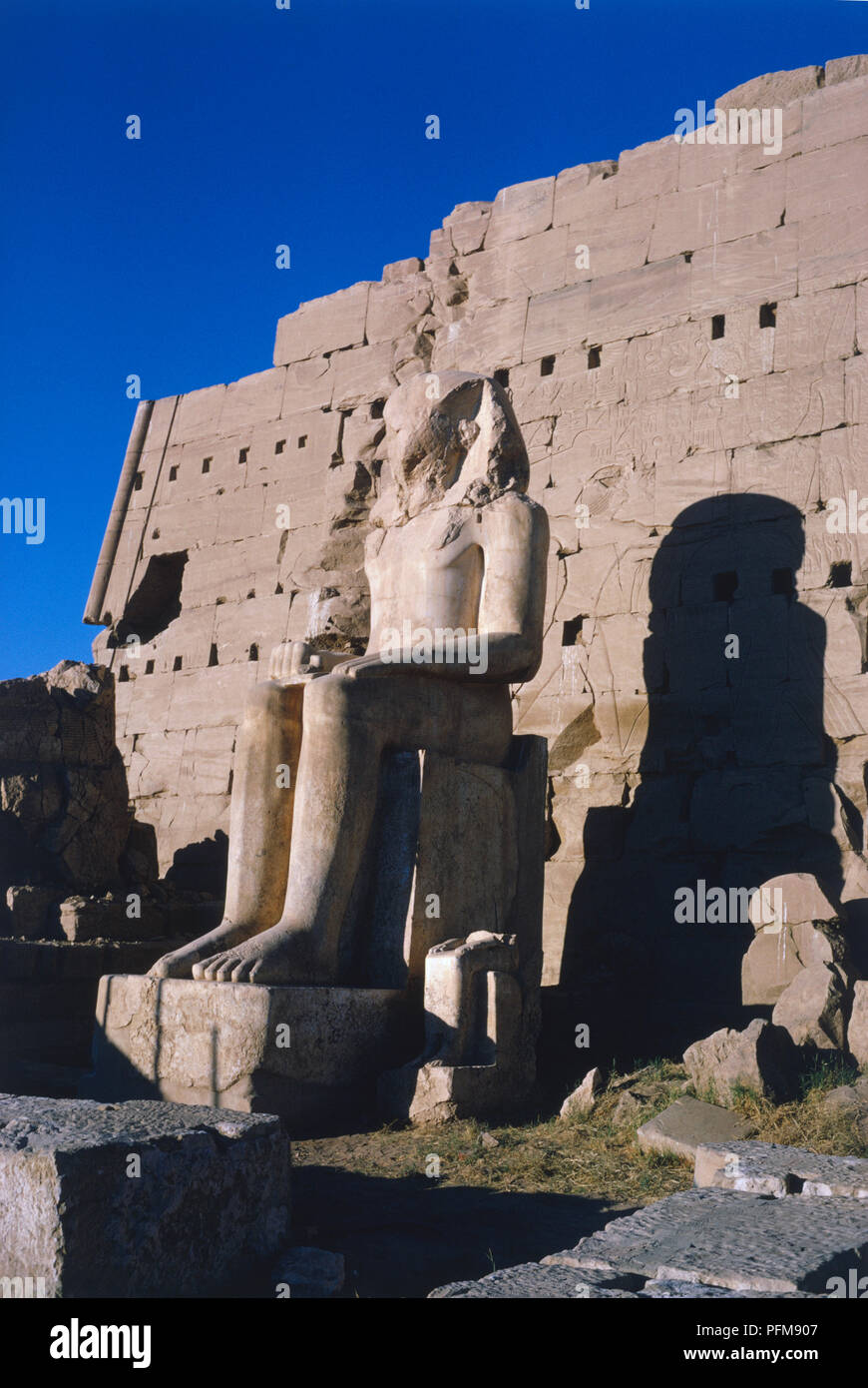 Egypt, Temple of Karnak complex, sitting Statue at the 7th pylon, face ...