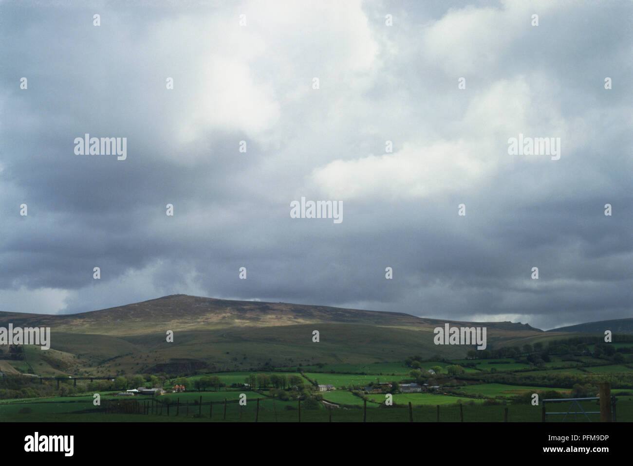 Stratocumulus, orographic clouds, large dark rounded mass, looming over ...