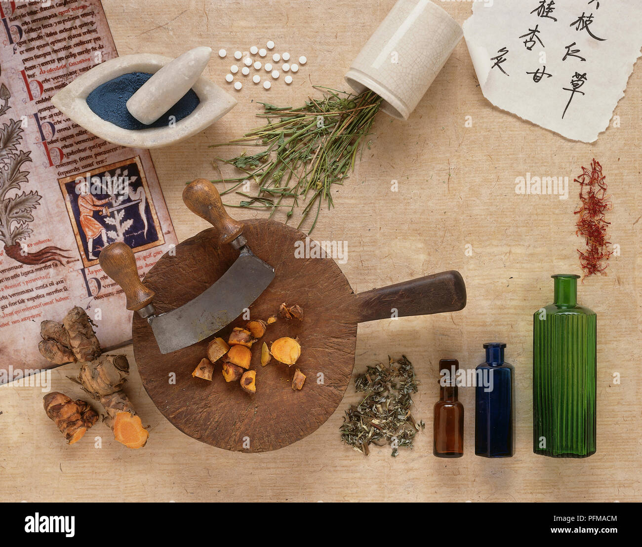 Selection of fresh and processed herbal remedies and utensils used to ...