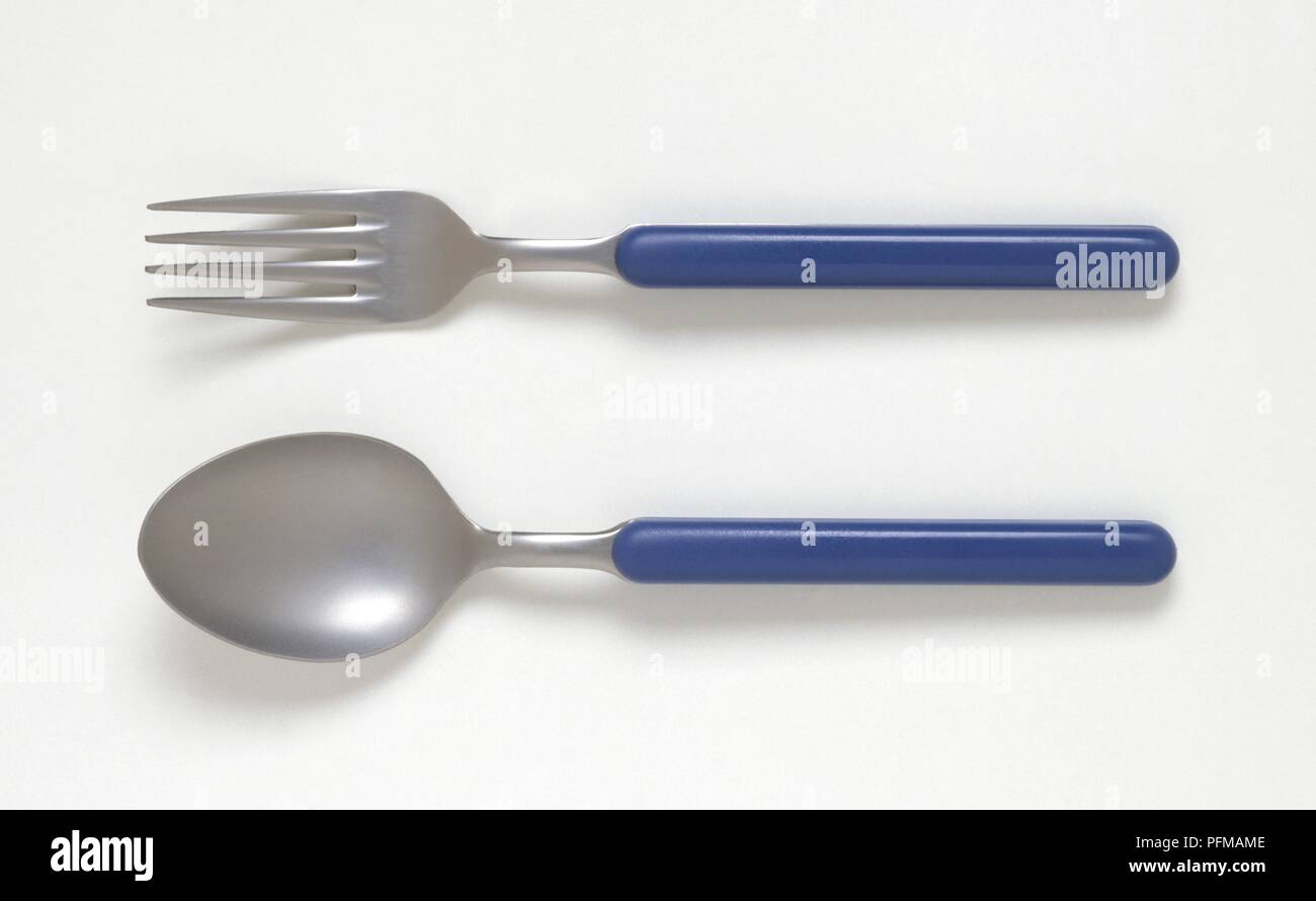 Dessert spoon and fork with blue plastic handles Stock Photo - Alamy