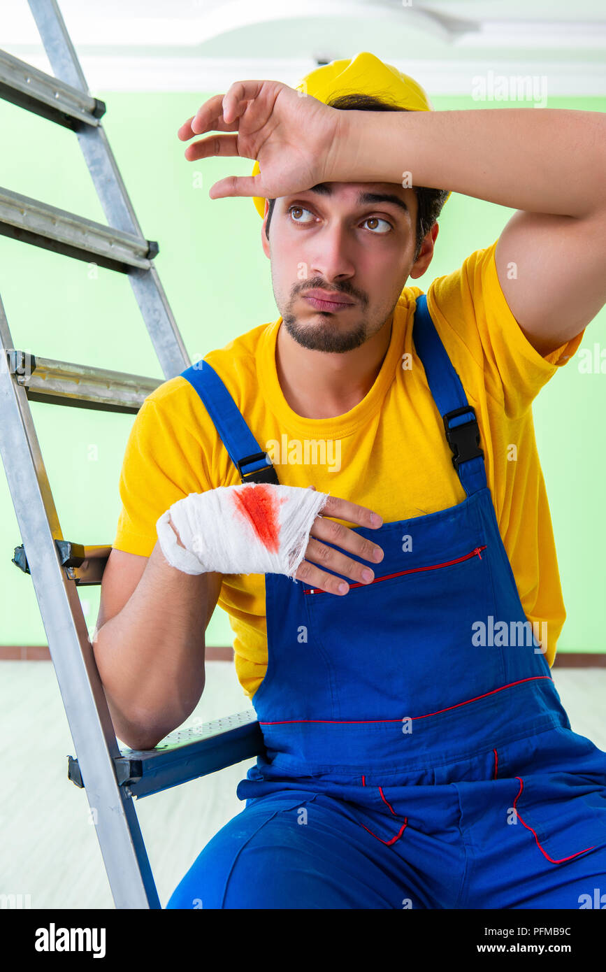 Injured worker at the work site Stock Photo - Alamy