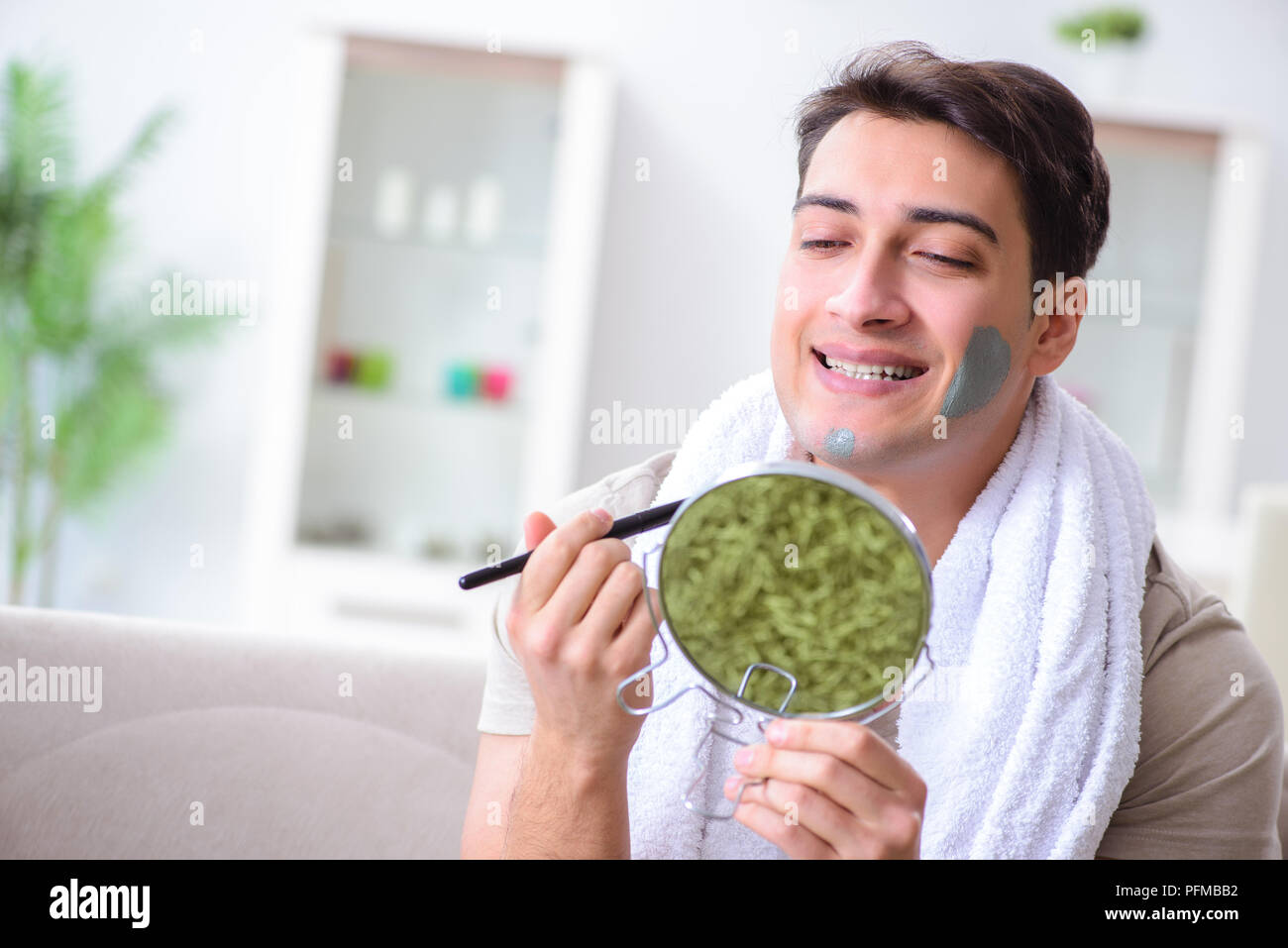 Man peeling off mask hi-res stock photography and images - Alamy