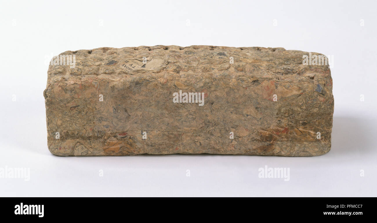Newspaper brick, close-up Stock Photo - Alamy