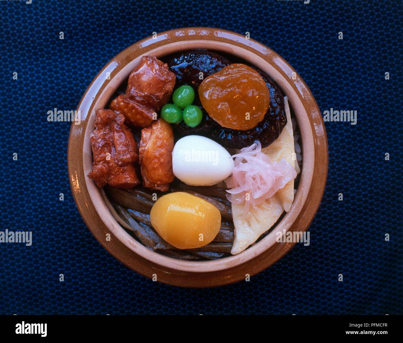 Kamameshi, a one-pot rice dish cooked with various types of seafood ...