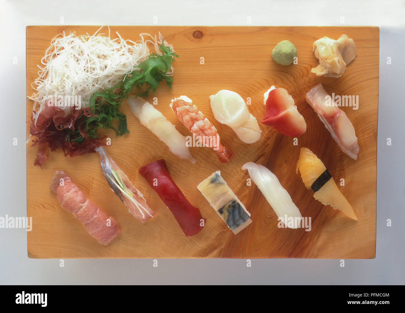 Nigiri-zushi, sushi platter including selection of raw fish laid over ...
