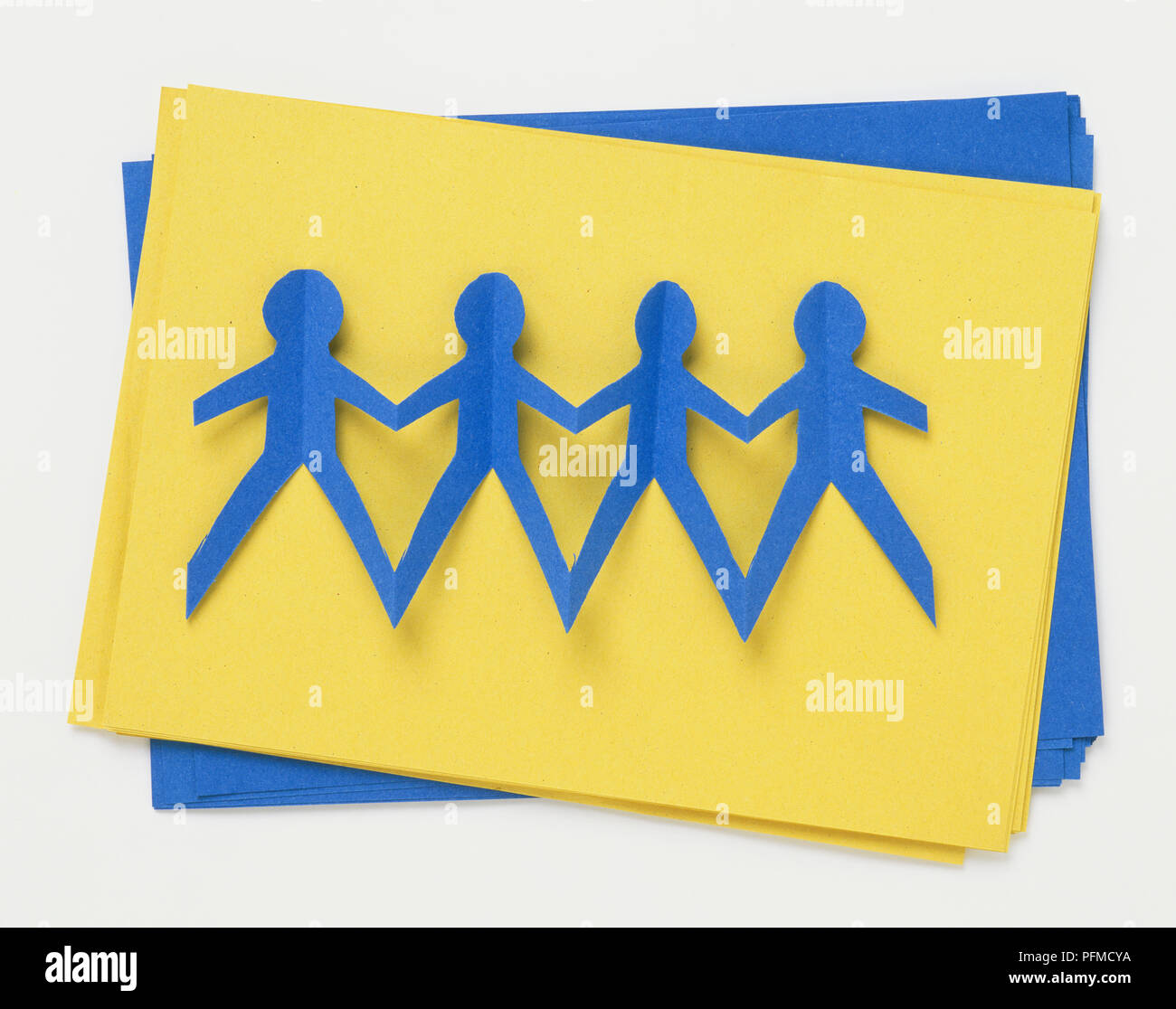 68). Concertina people cut from coloured paper Stock Photo - Alamy