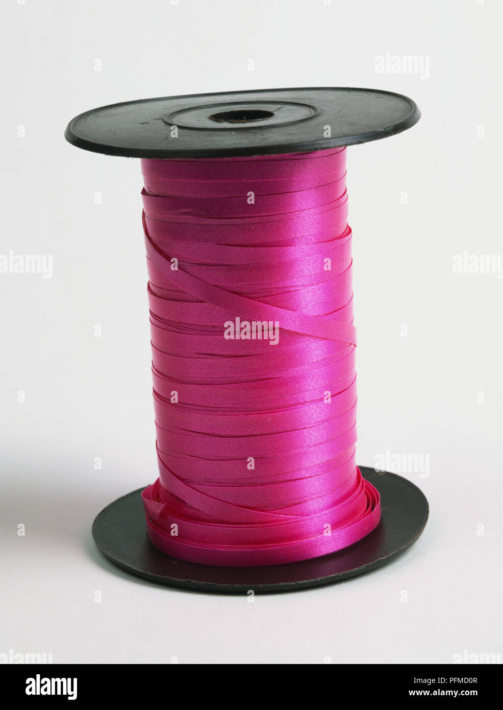 Reel of pink ribbon Stock Photo - Alamy