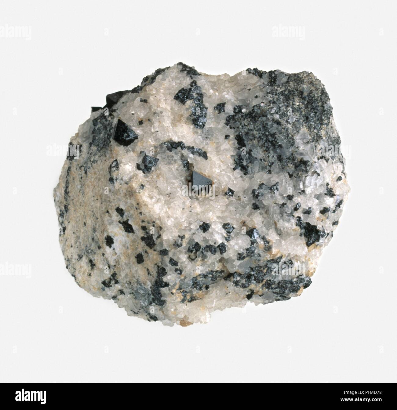 Spinel, forming as dark pleonaste crystals in quartz groundmass Stock ...