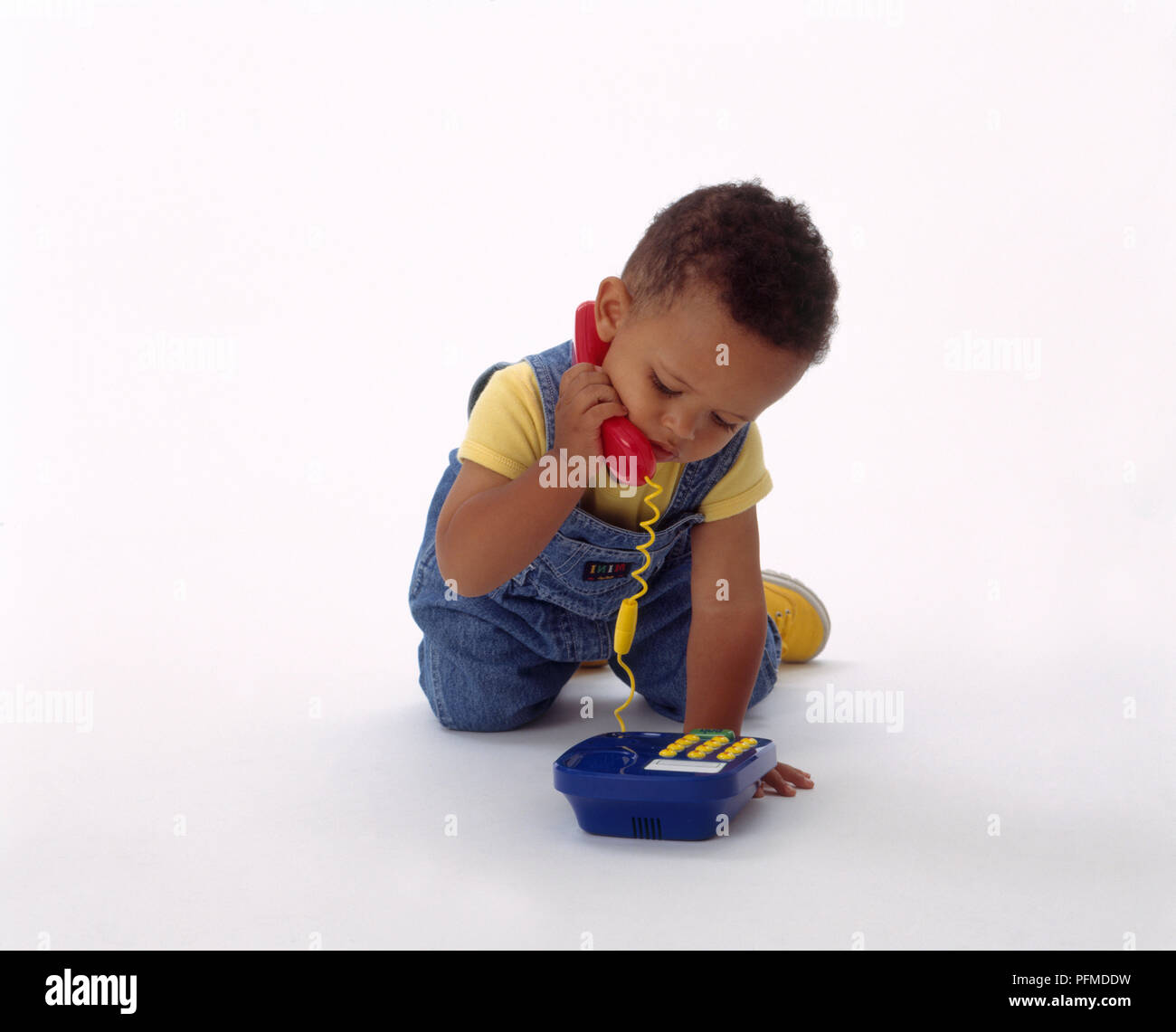 Boy on play phone, close-up, front view Stock Photo - Alamy