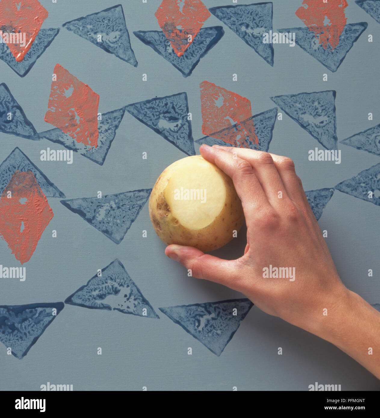 Making triangular and diamond shape potato prints Stock Photo - Alamy