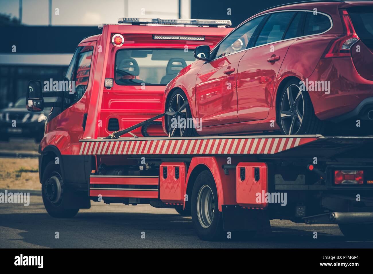 Red Broken Car on a Red Towing Truck. Closeup Photo. Vehicle Mechanical ...
