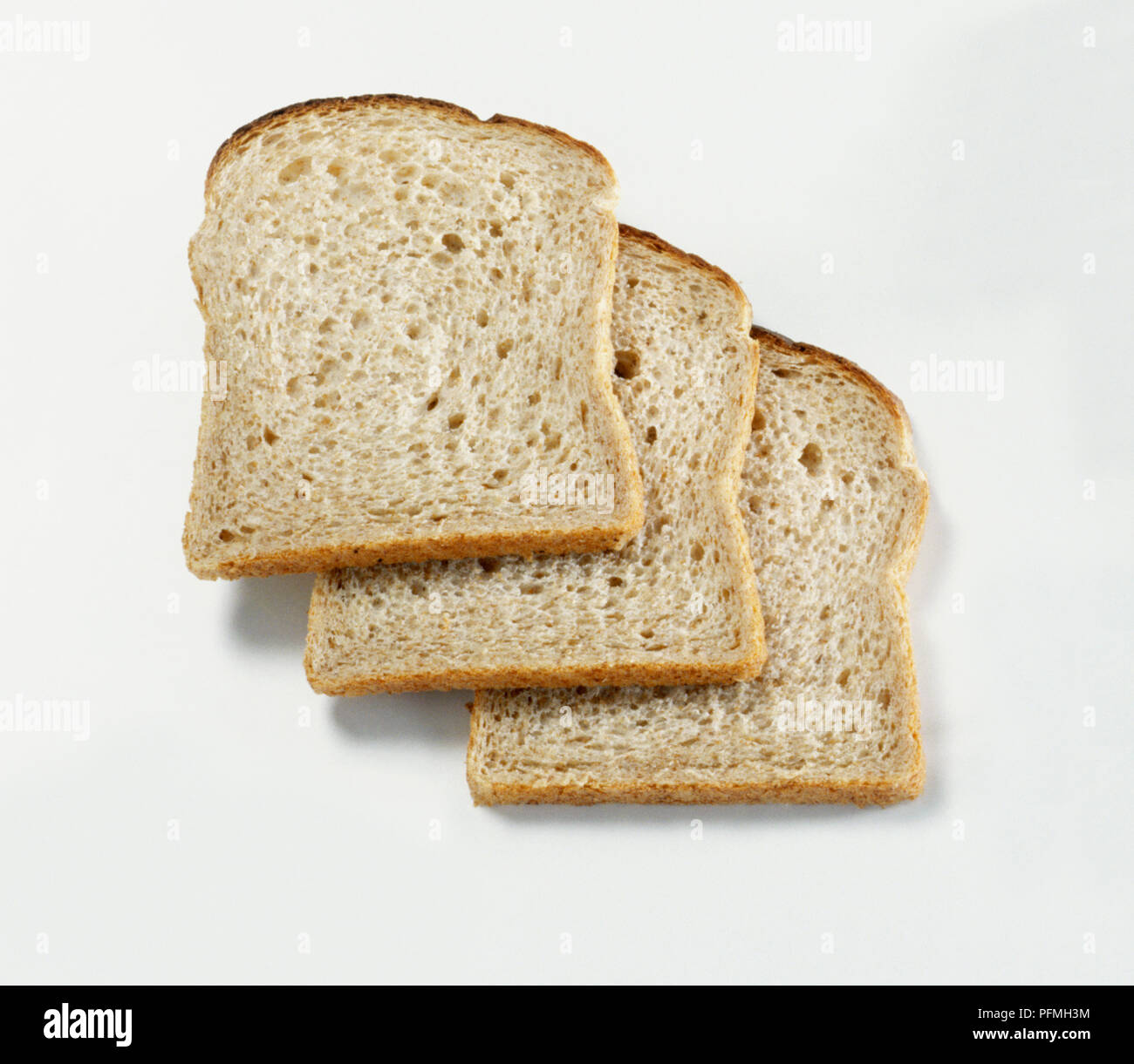 Three slices of wholemeal bread Stock Photo - Alamy