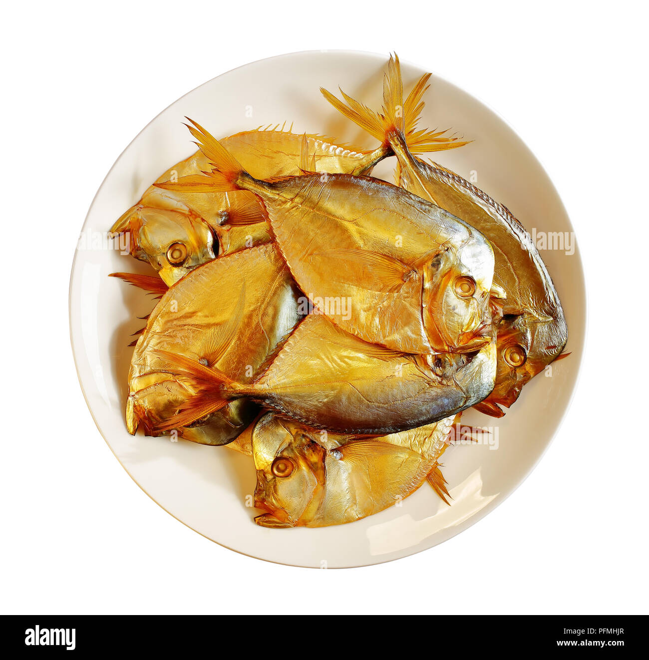 delicious cold smoked moon fishes on white platter isolated on white ...