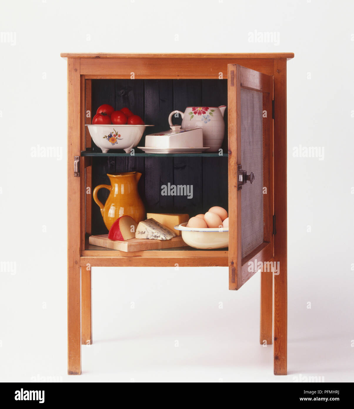 Kitchen larder containing fresh produce such as cheese and vegetables ...