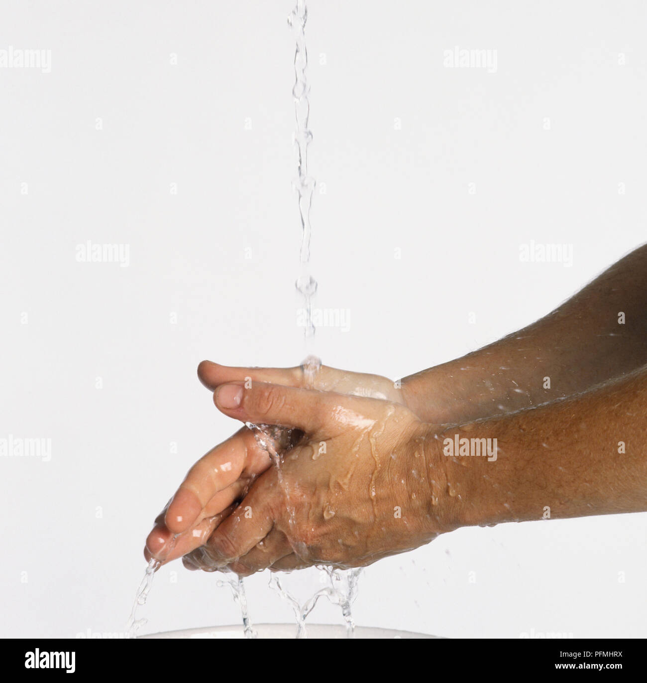 Washing hands under running water, section Stock Photo - Alamy