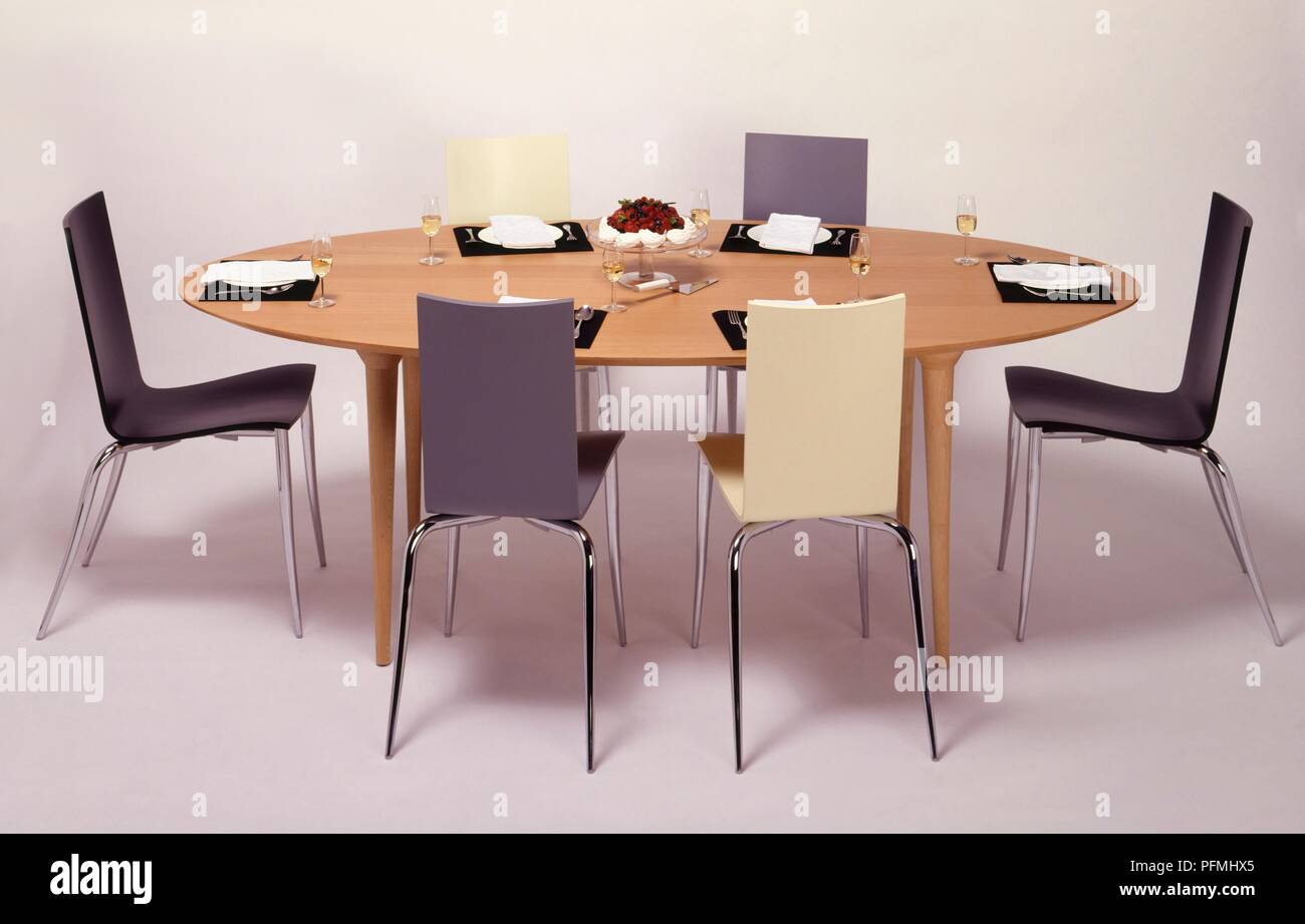Oval table set for dining Stock Photo - Alamy