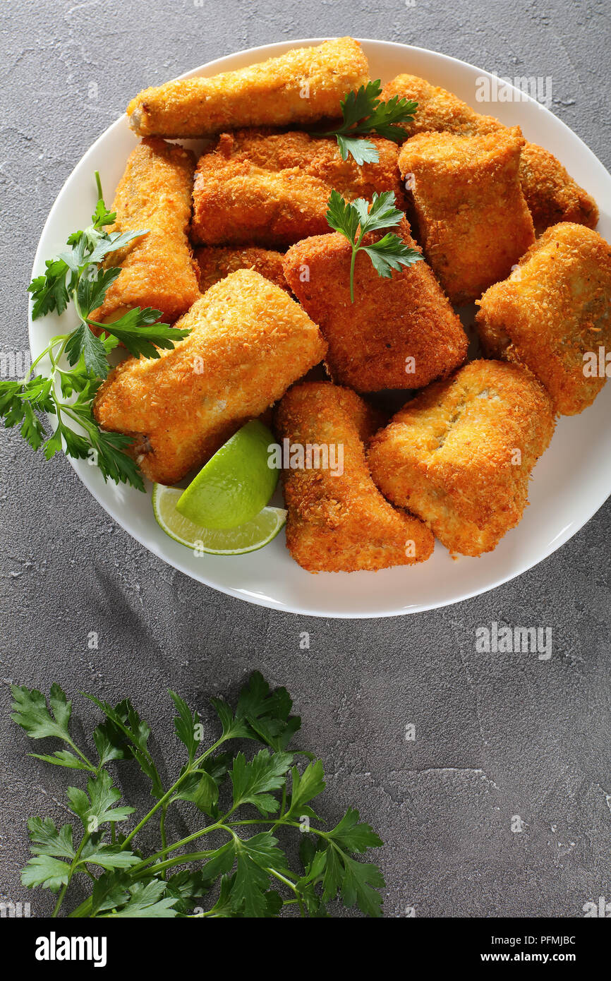 delicious pieces of crispy fried fish coated with coconut bread crumbs ...