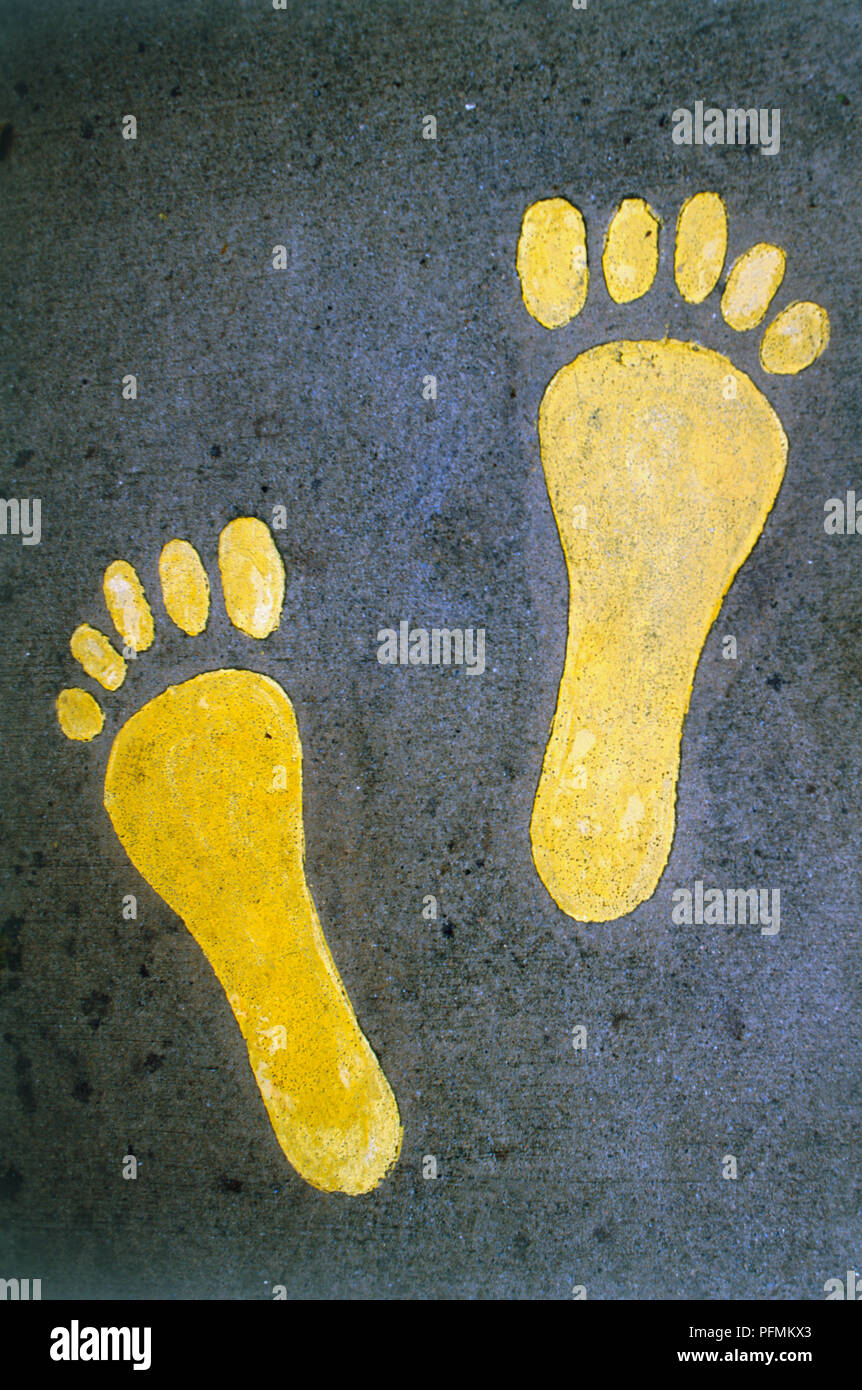 Singapore, East Coast Park, yellow footprints printed on dark grey ...