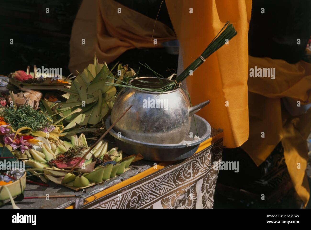 Bali, pot of holy water next to offerings at a temple Stock Photo - Alamy