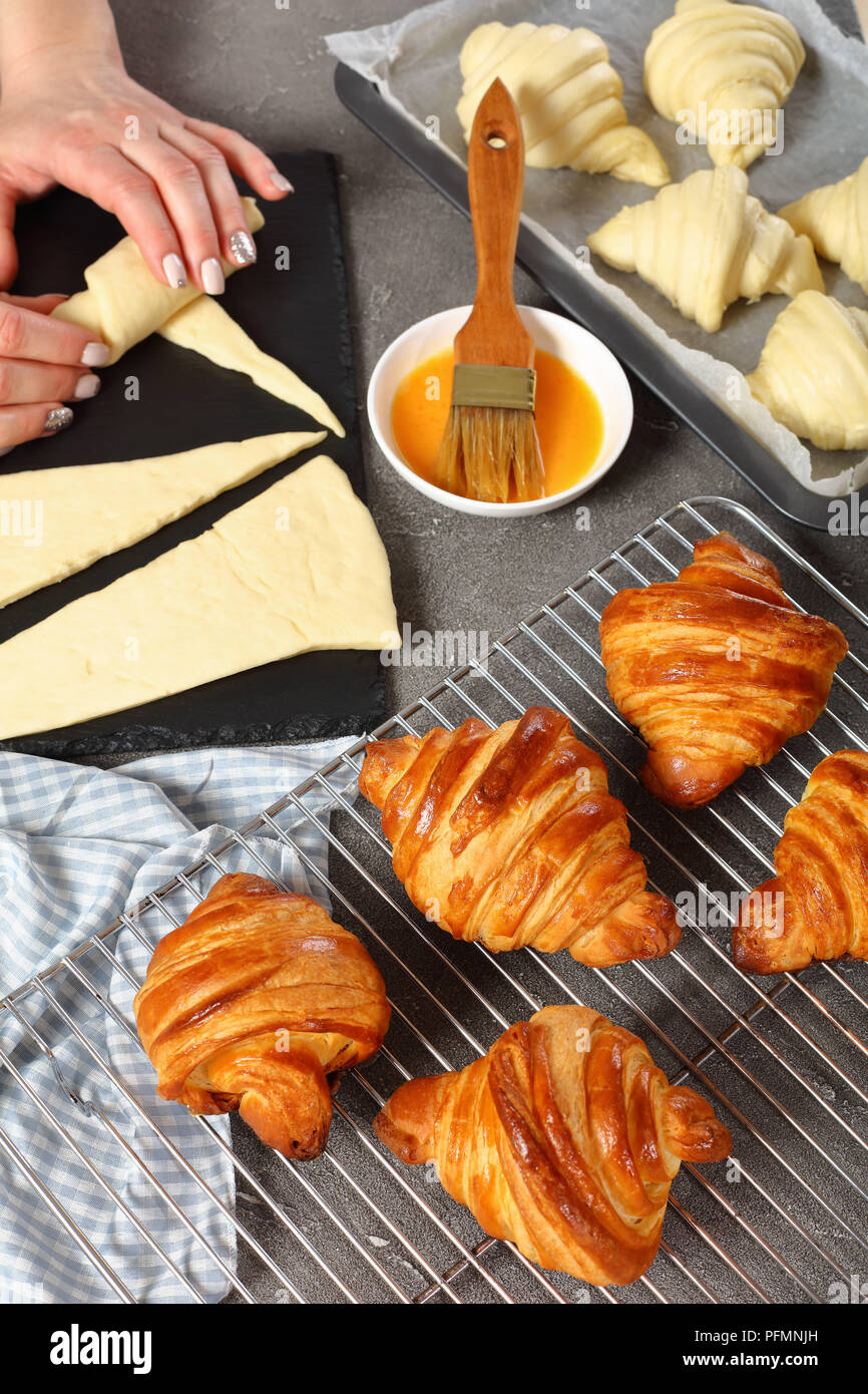 Woman is shaping puff pastry dough into crescent rolls to bake French ...