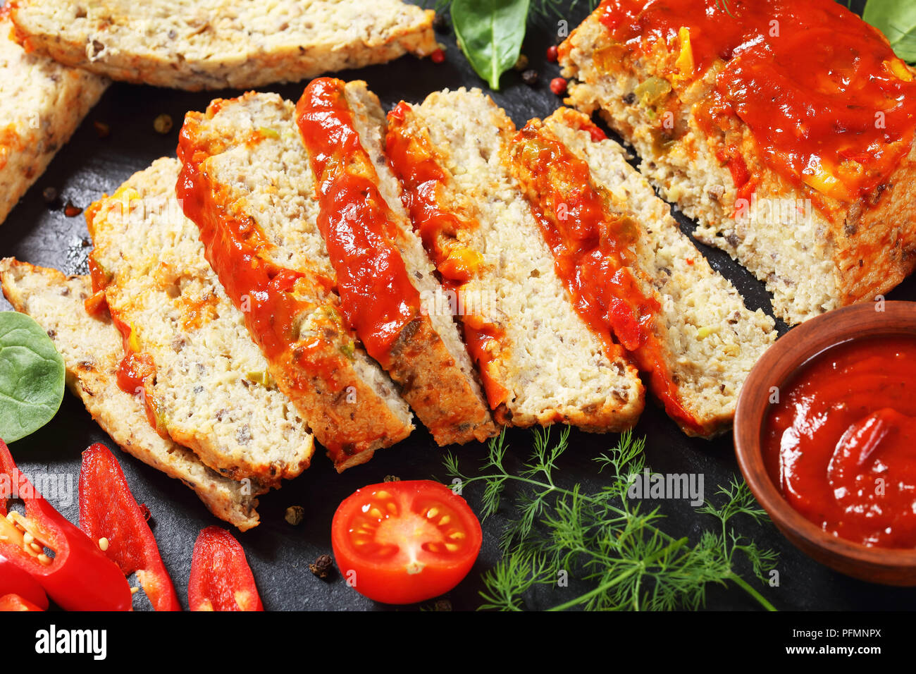 close-up of juicy baked fish terrine of minced white fish fillet served ...
