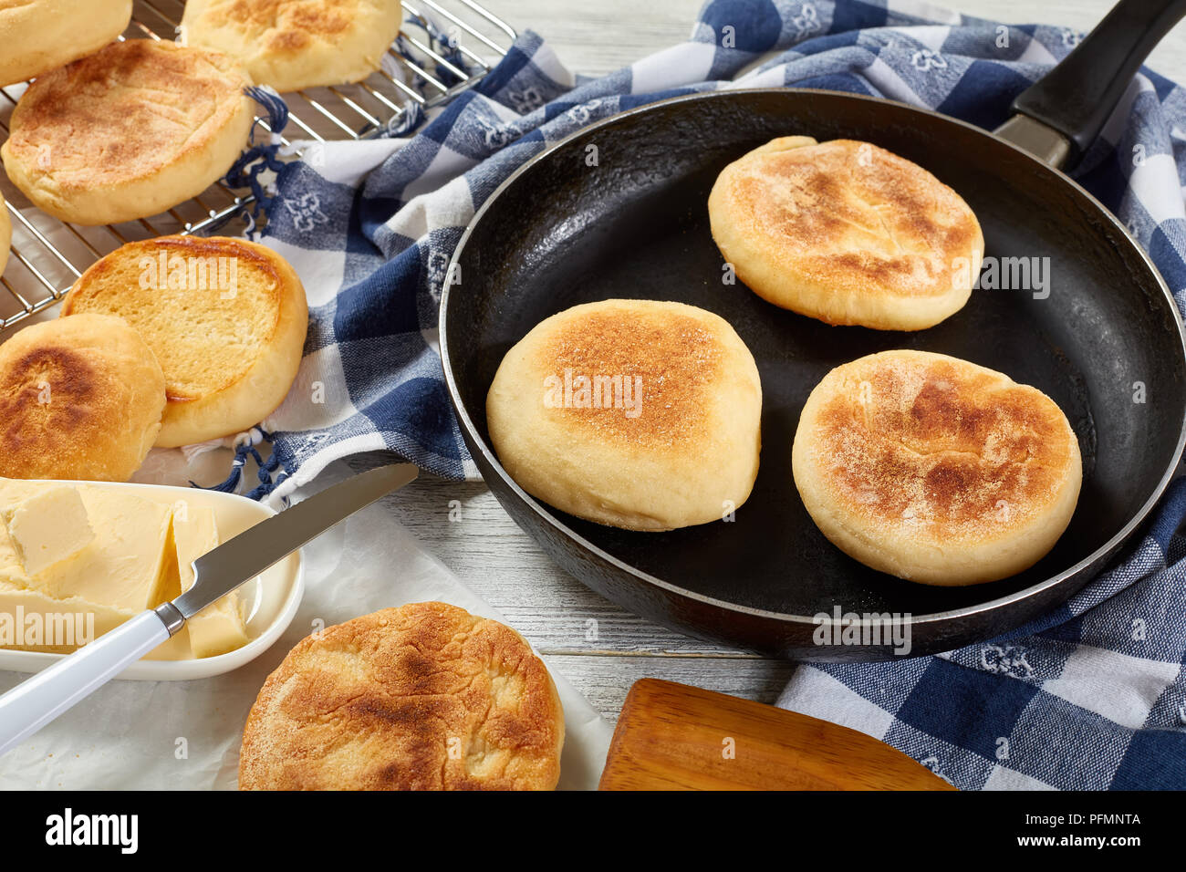 cooking breakfast - baking english muffins on a dry skillet and ...