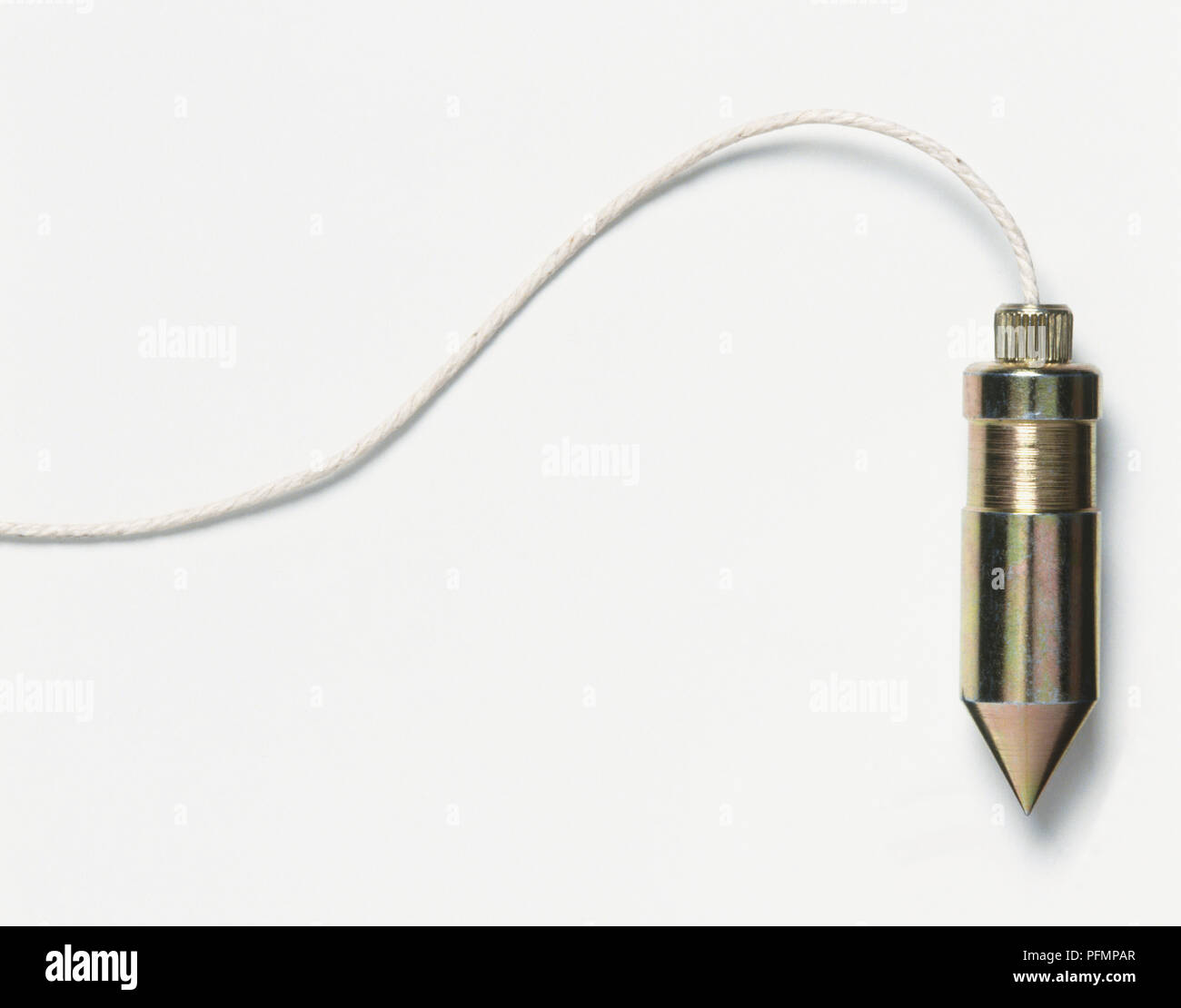 Weight on a string Stock Photo - Alamy