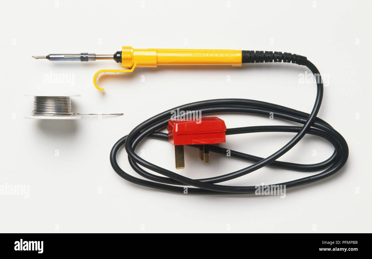 Soldering iron, unplugged, and solder Stock Photo - Alamy