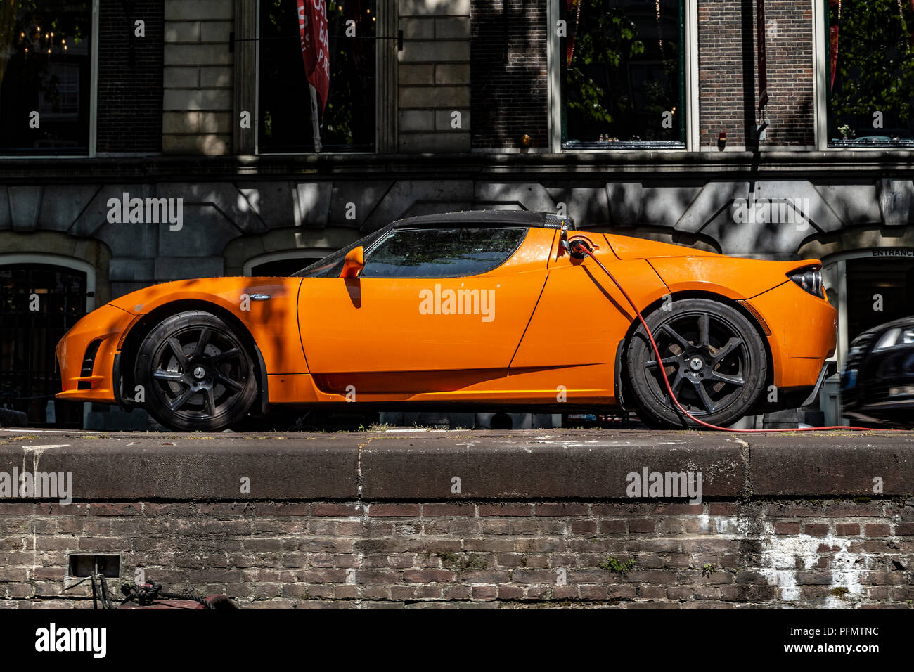 Tesla car parked in the street in Amsterdam, Netherlands Stock Photo ...