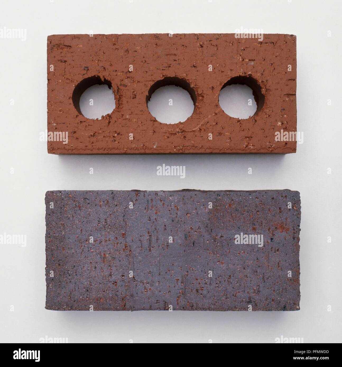 A cored brick and an engineering brick Stock Photo - Alamy
