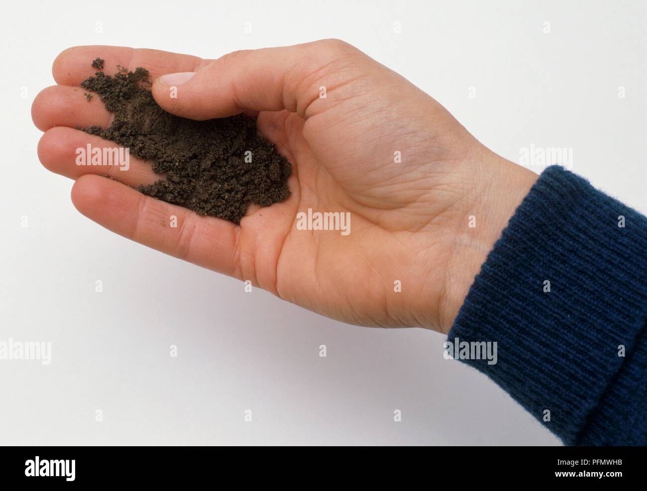 Sandy soil hand hi-res stock photography and images - Alamy