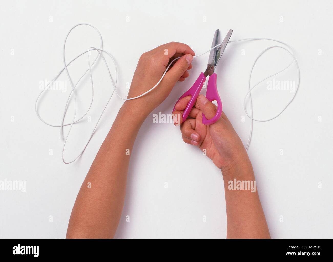 Hand holding pair scissors hi-res stock photography and images - Alamy