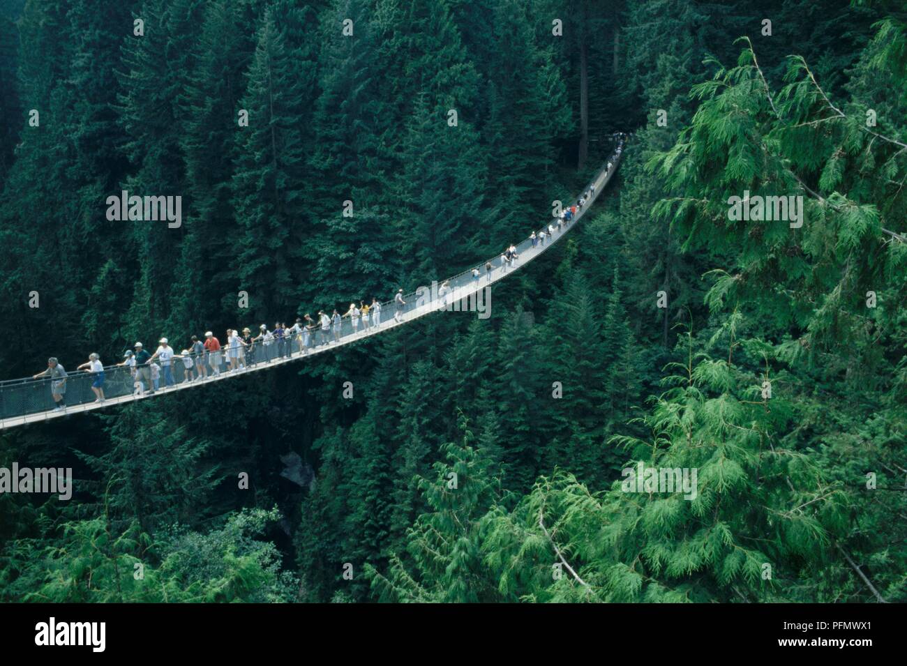 Child crossing rope bridge hi-res stock photography and images - Alamy