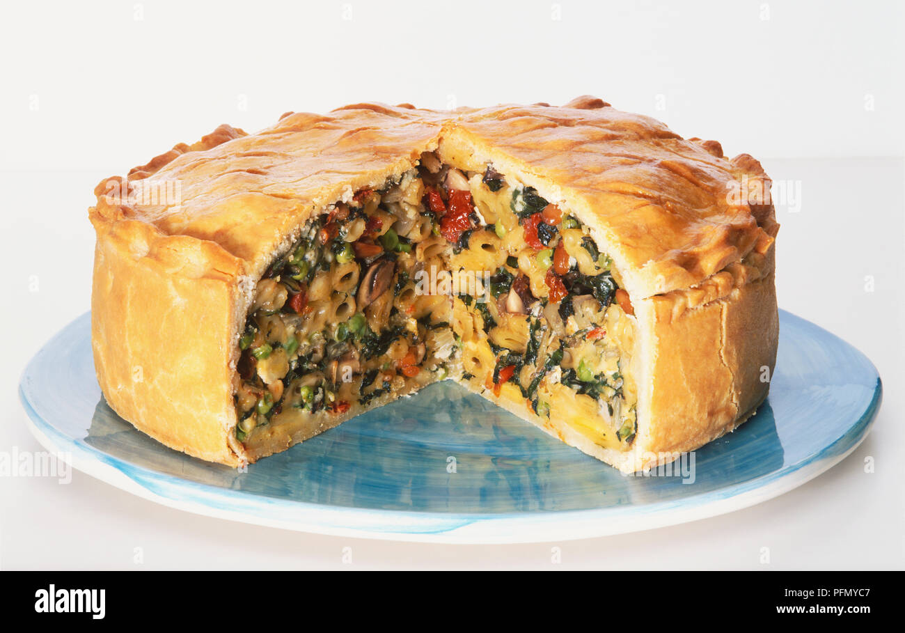 Pasta pie with removed slice revealing cross-section, close up Stock ...