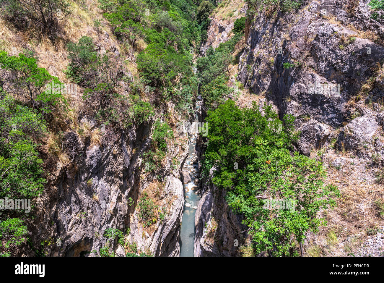 views of il Ponte del diavolo and the Raganello river in Civita inside ...
