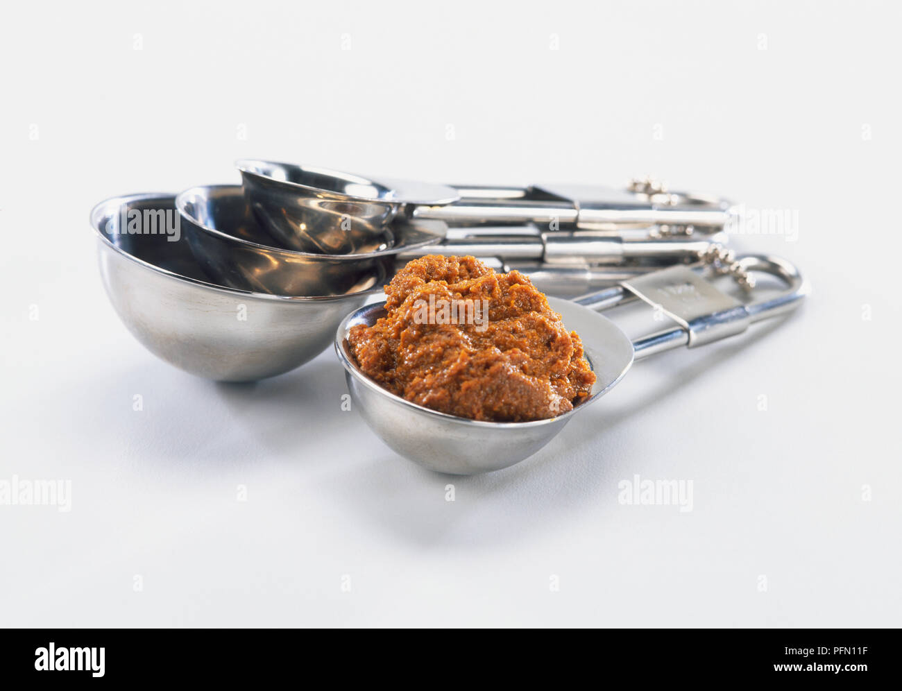 Measuring each other hi-res stock photography and images - Alamy