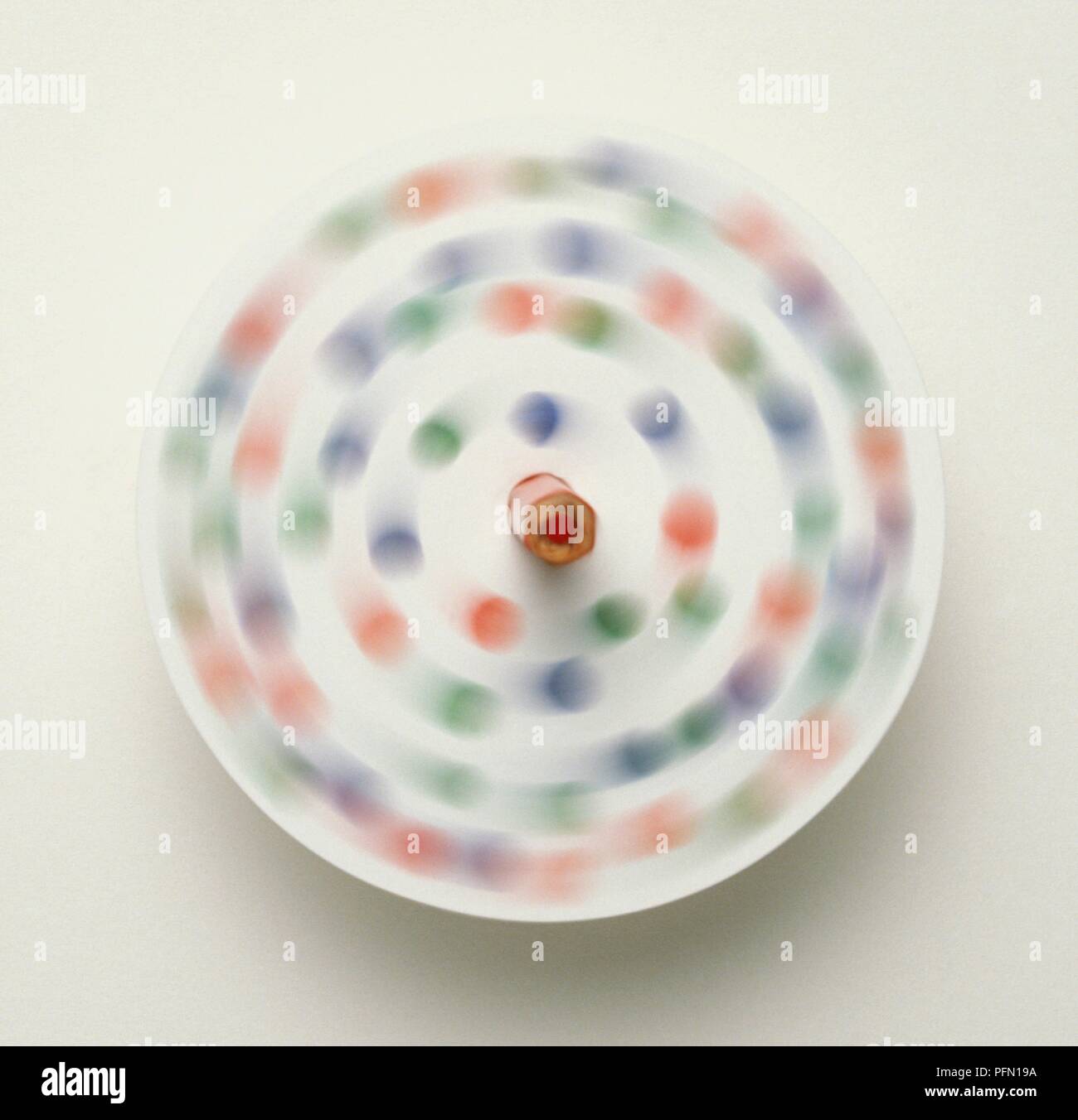 A spinning top in motion Stock Photo - Alamy