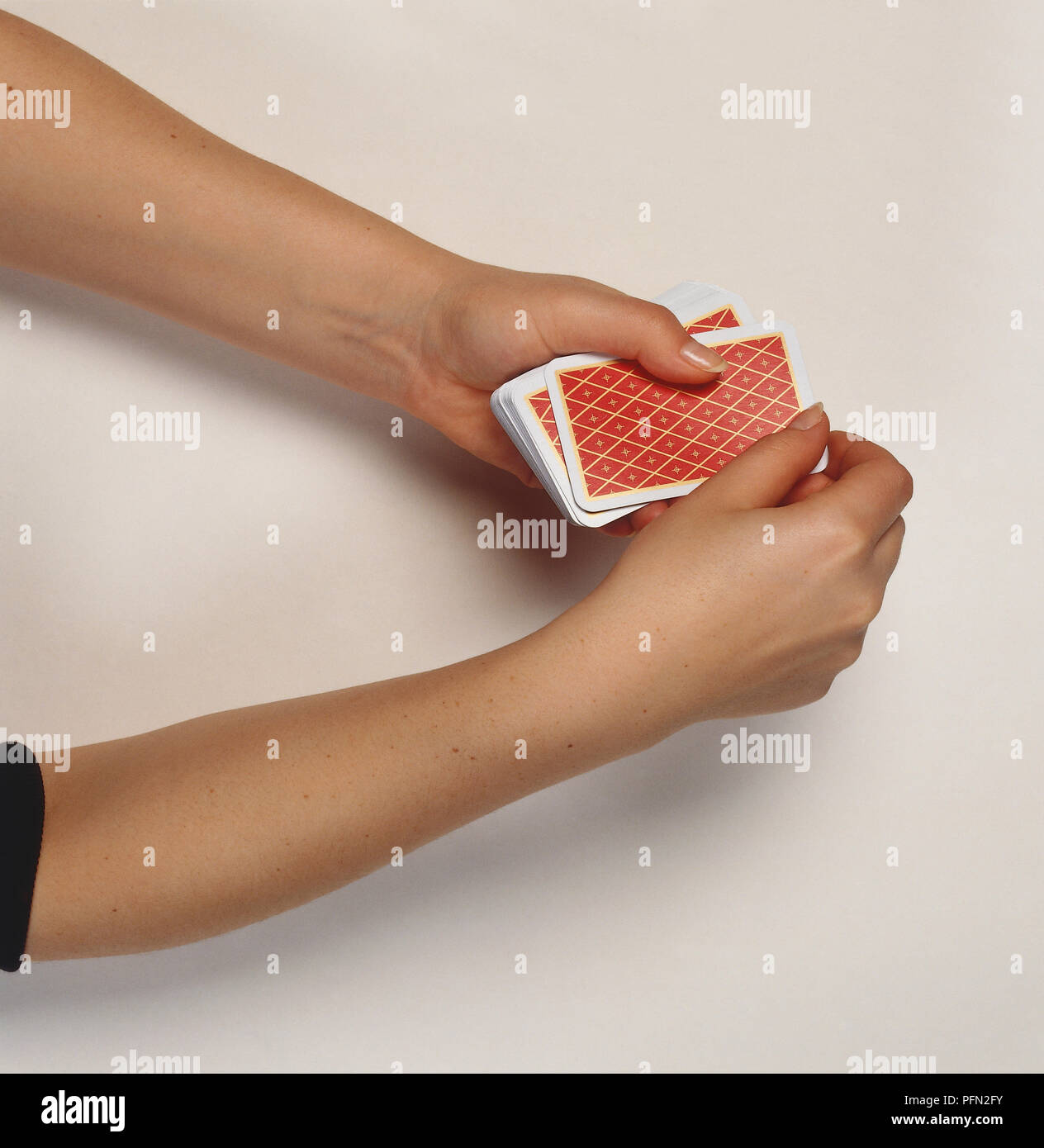 Dealing out cards Stock Photo - Alamy