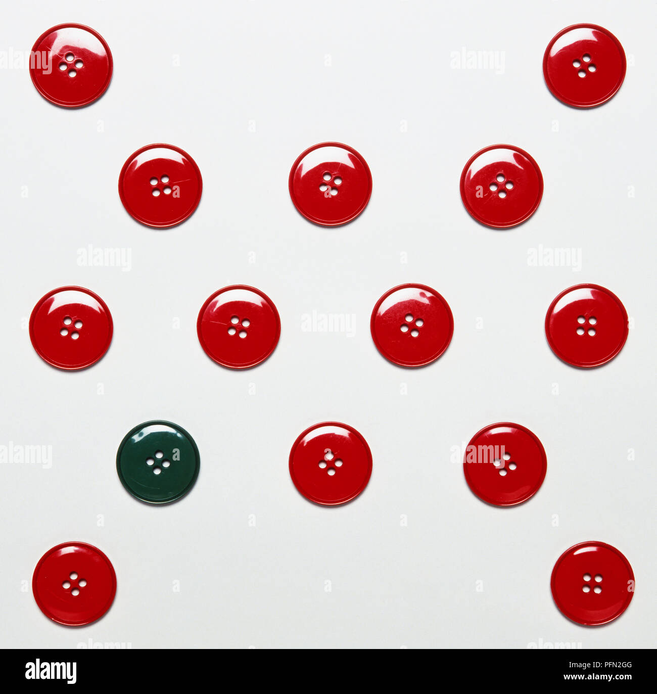 Thirteen red buttons and one green button, close up Stock Photo - Alamy