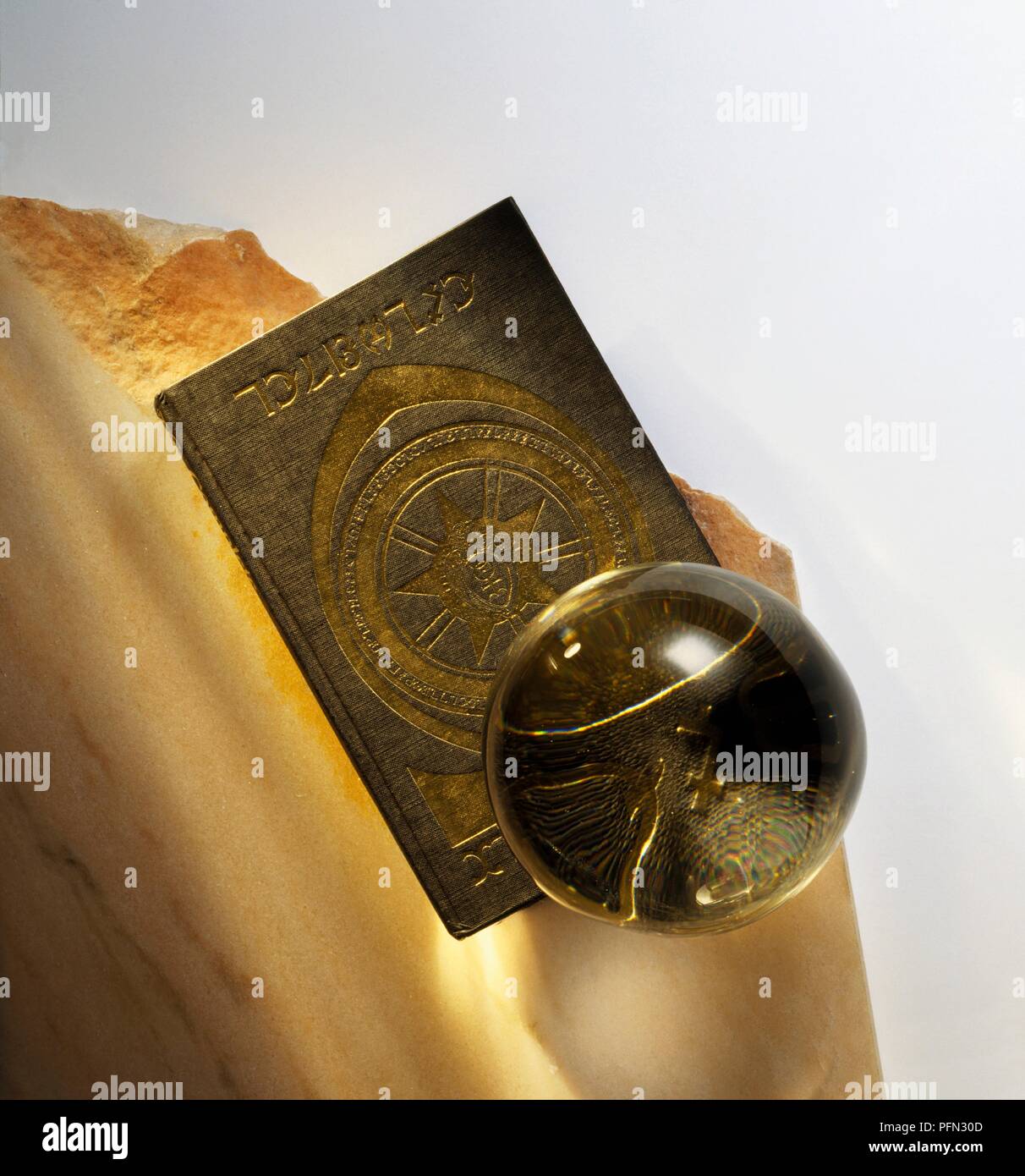 Crystal ball and book of Language of Angels Stock Photo - Alamy