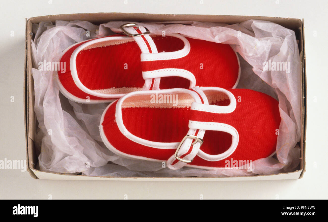 Pair of red children's shoes in open shoe box, view from, above Stock ...
