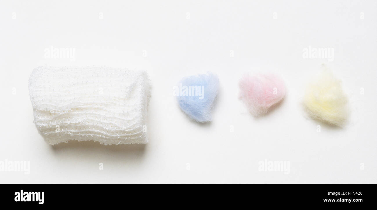 White, rolled up gauze bandage and cotton wool Stock Photo - Alamy