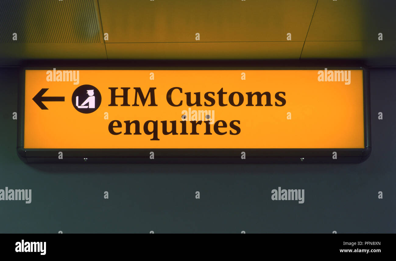 Great Britain, airport sign, 'HM Customs enquiries' Stock Photo - Alamy