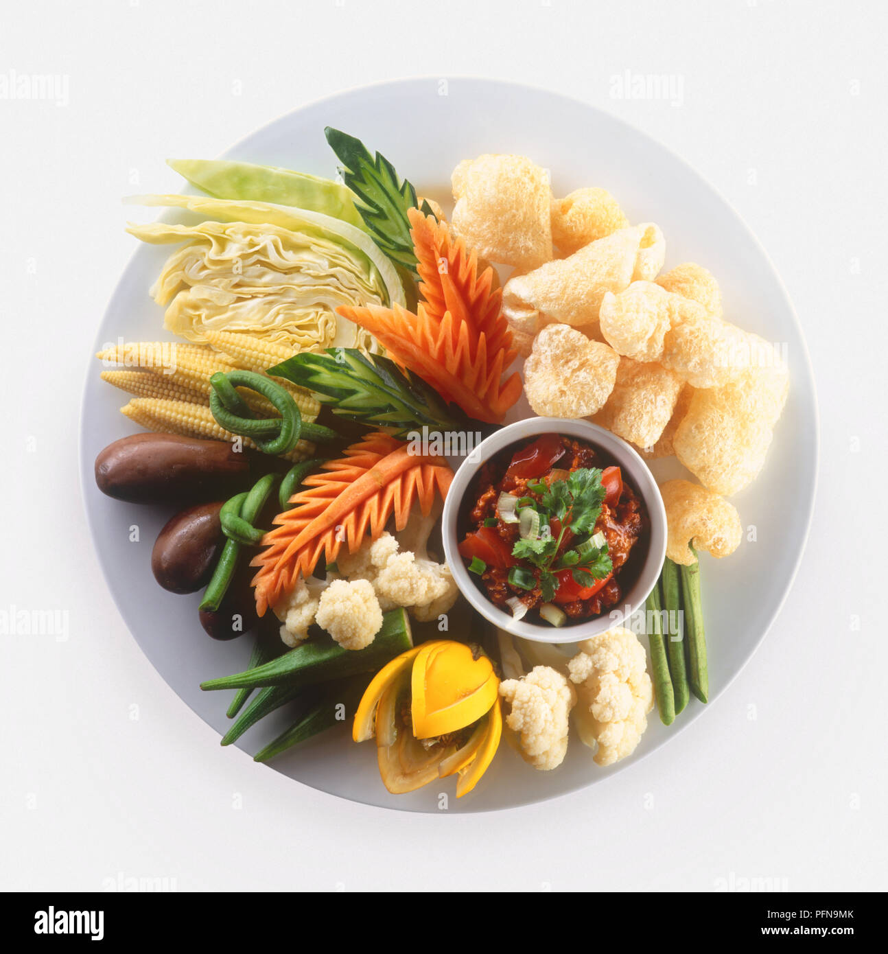 Nam Phrik Ong, pork crackling and raw vegetables served with chilli dip ...