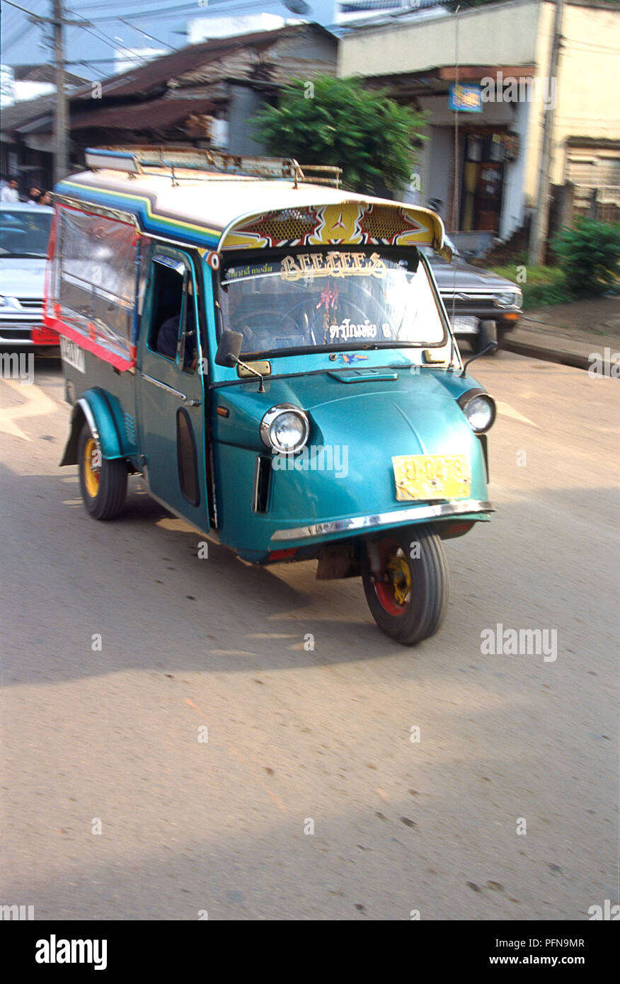 Thailand, Trang, Trang Town, tuk-tuk driving on street Stock Photo - Alamy