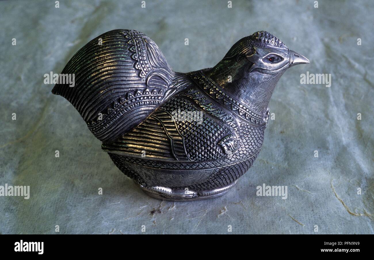 Silver bird from Thailand Stock Photo - Alamy