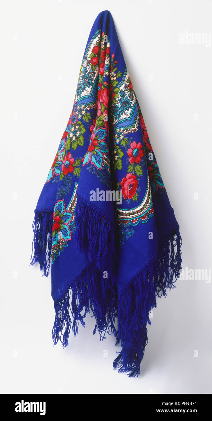 Russian scarf, blue with colourful flower pattern, hanging from wall ...