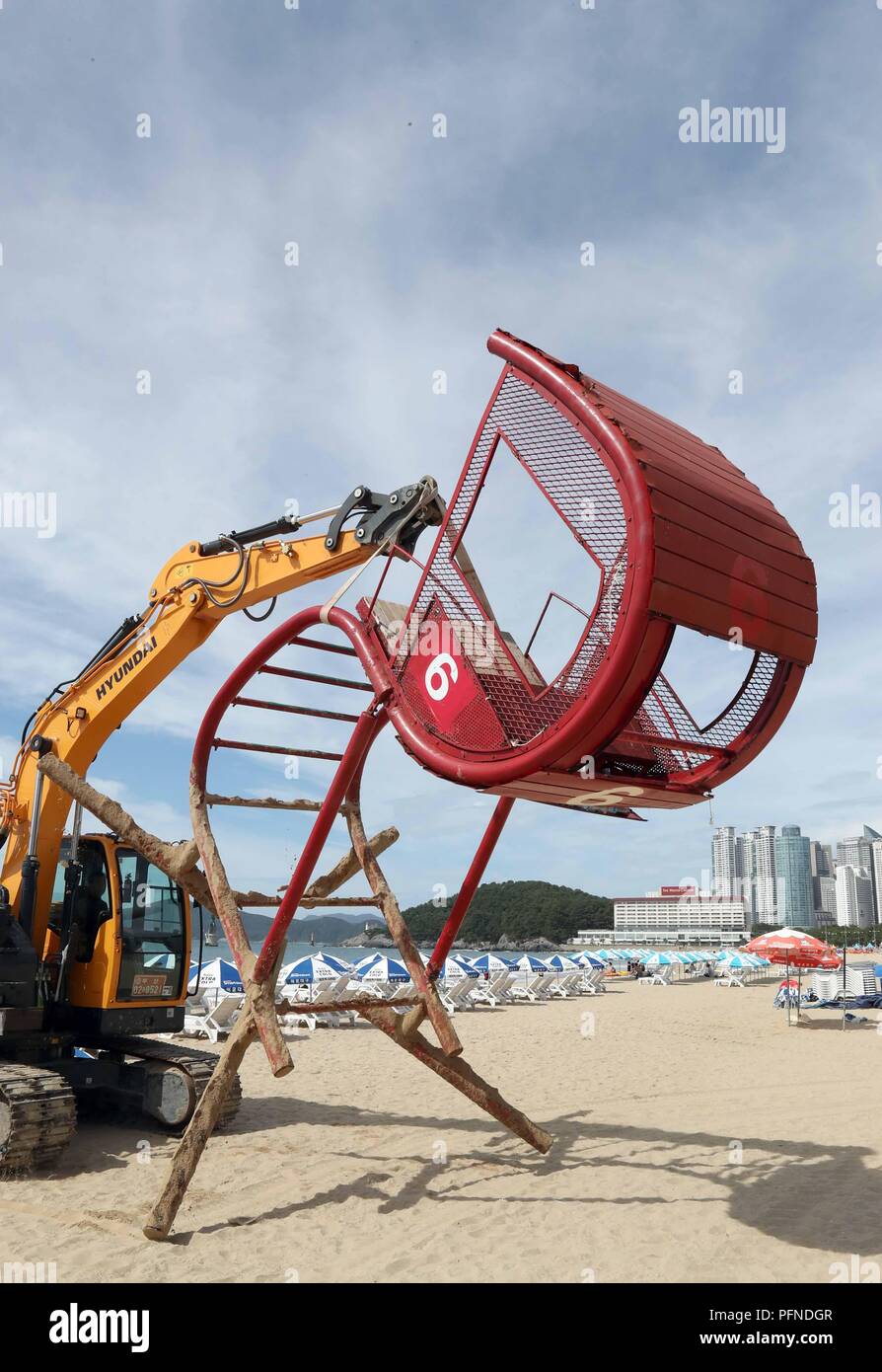 22nd Aug, 2018. Prepping for typhoon A crane moves a portable ...