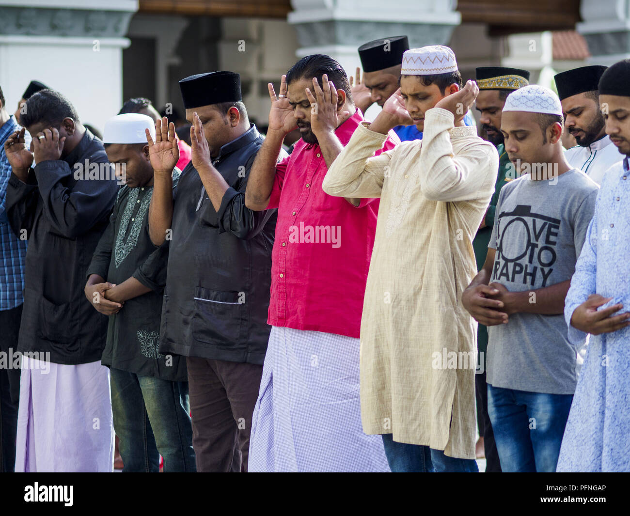 George Town, Penang, Malaysia. 22nd Aug, 2018. Men pray during Eid al ...